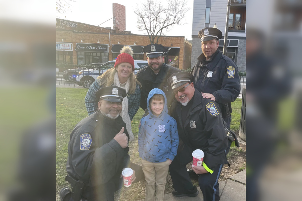 Helpers Dressed as Blue Santa in Boston Bring Sleigh Bells and Safety