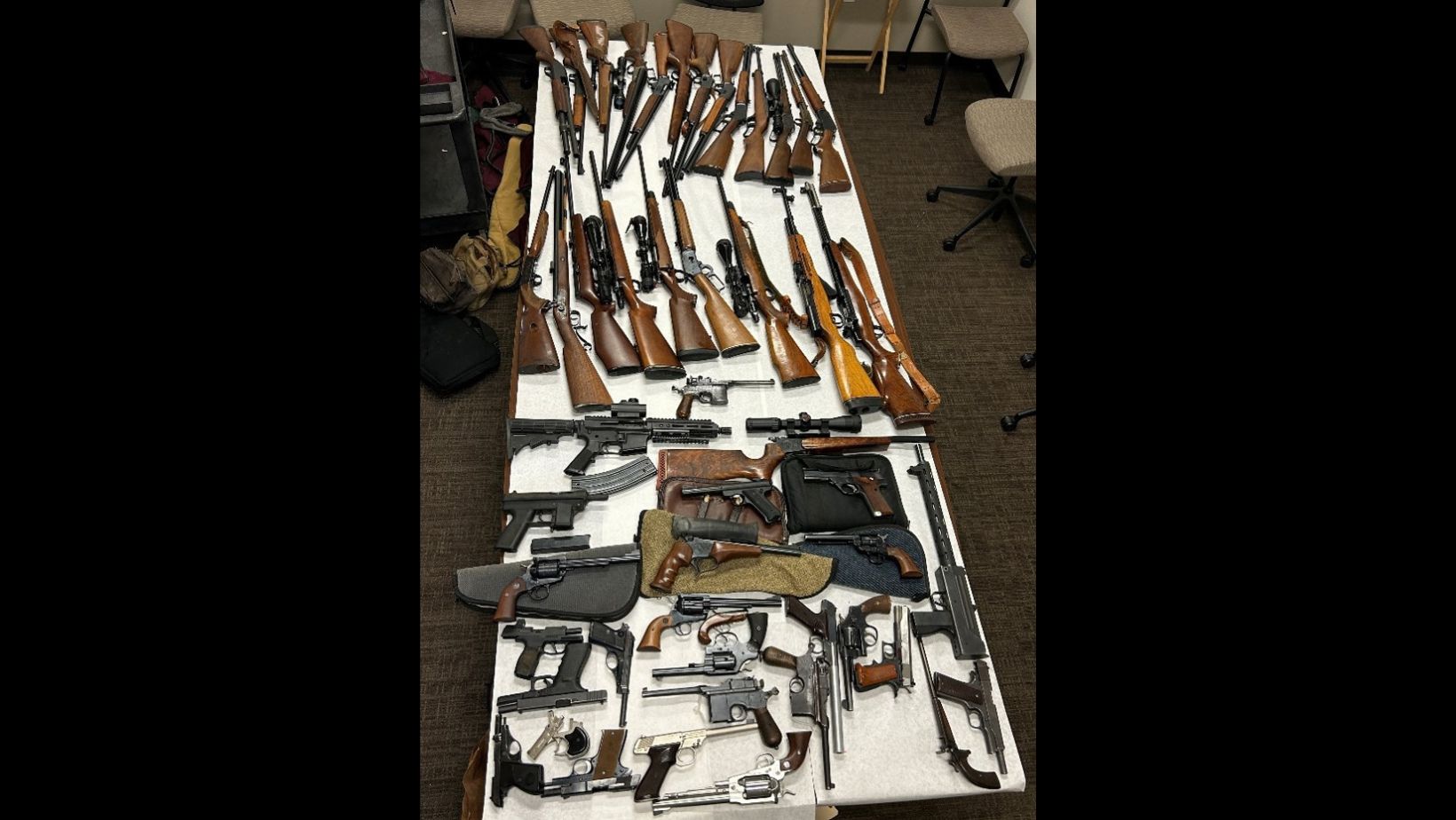 Warrant for Assault with Deadly Weapon Reveals Massive Cache of Guns