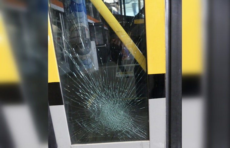 Man Vandalizes MBTA Bus in Jackson Square, Prompting Investigation and
