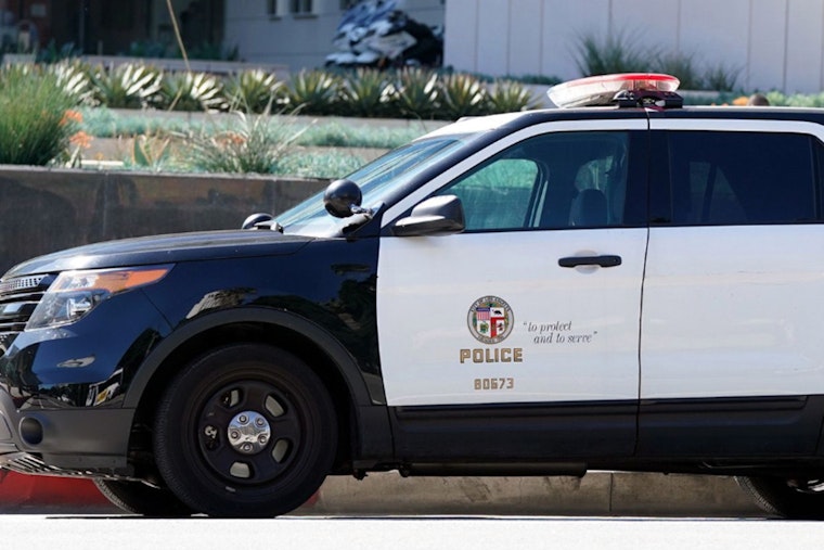 Man Takes to Bus Roof for Exercise Routine in Downtown Los Angeles