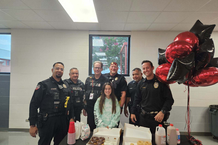 Young Community Member Joins Argyle ISD Police for Donut Breakfast