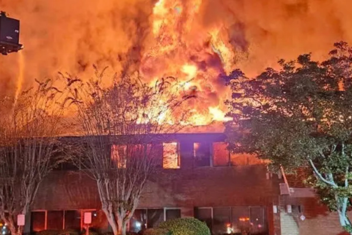 Austell Congregation Holds Outdoor Service Amidst Charred Church