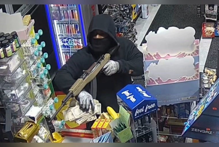 Manhunt Underway for Suspect in Armed Robbery with AK-47 at Troy Gas
