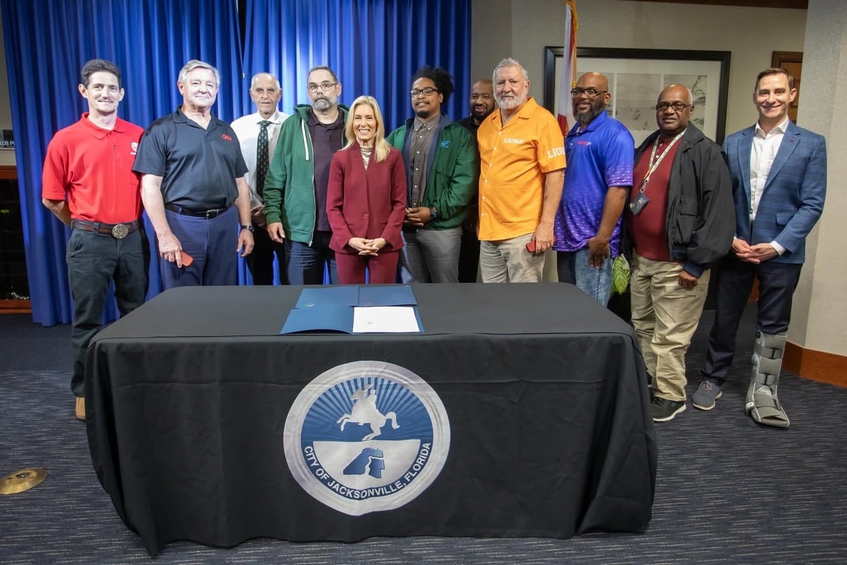Mayor Deegan Signs Agreement to Boost Pay for 2,600 Workers in