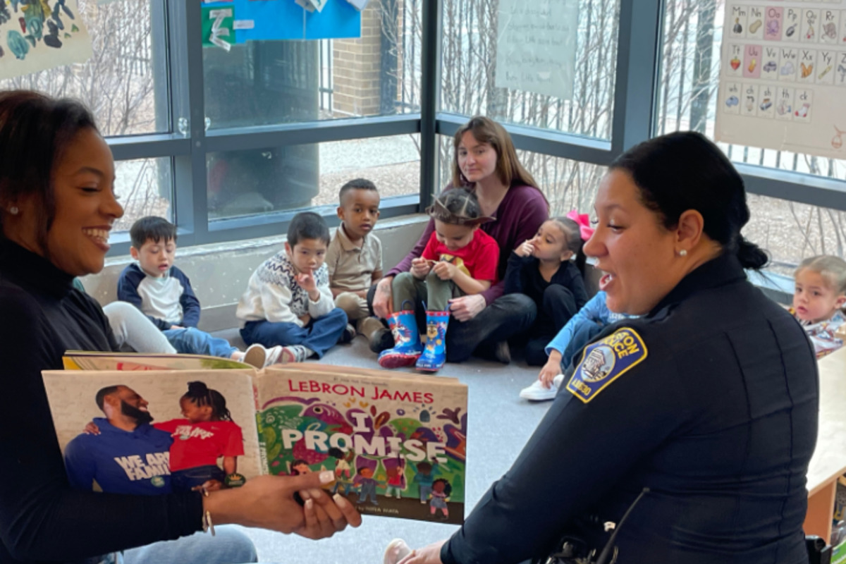 Boston Police Officers Embrace Storytelling with Kids at Roxbury YMCA