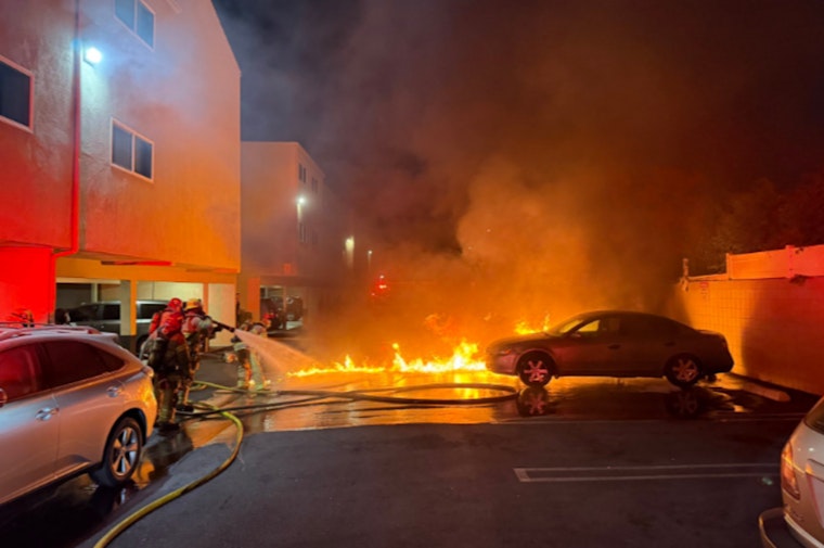 Orange County Firefighters Quell Vehicle Blazes in Apartment Complex,