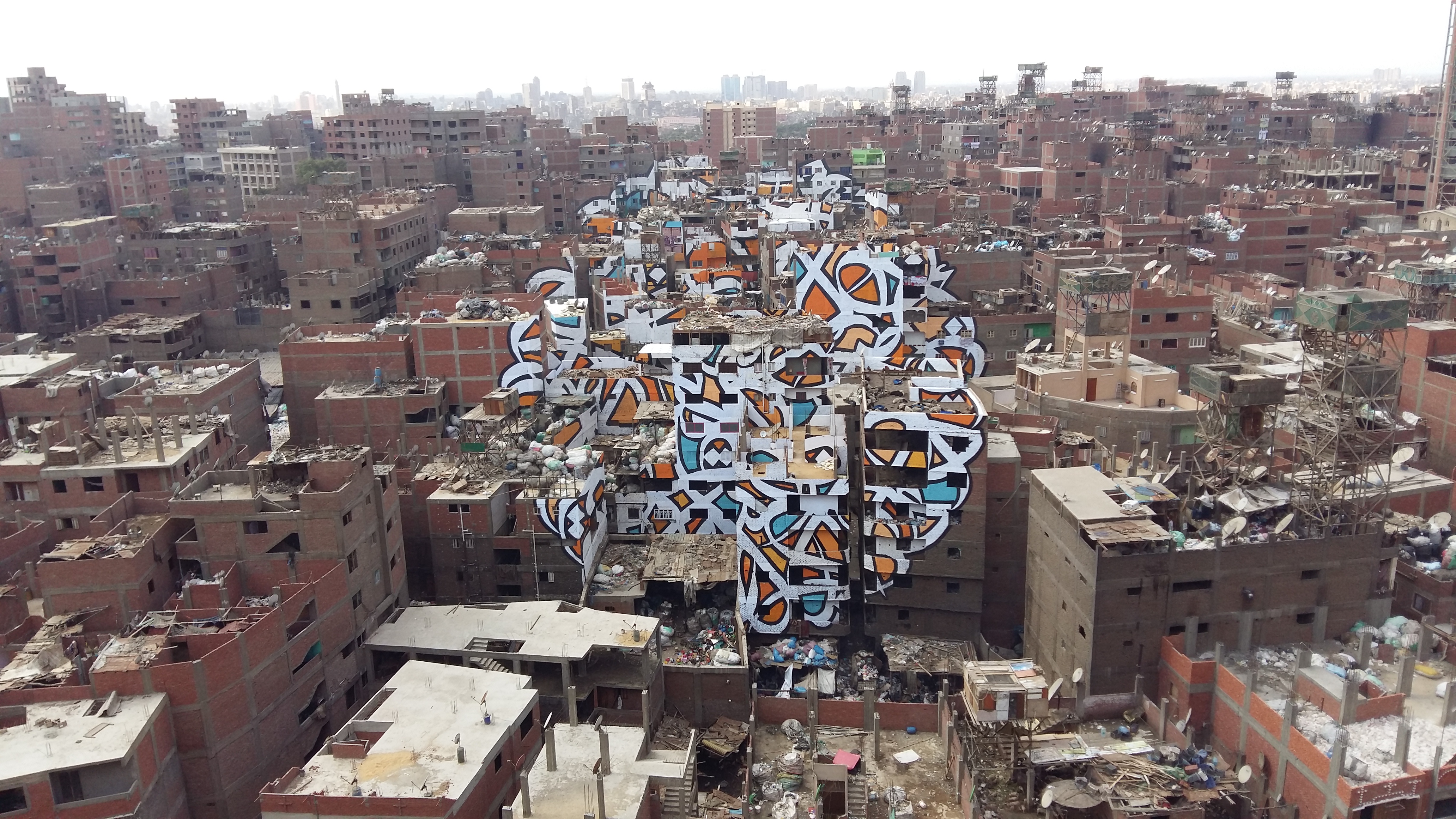 Artist "eL Seed" Paints Massive Graffiti in Cairo