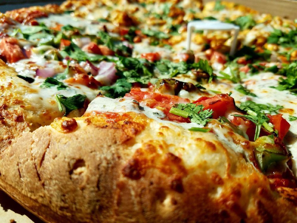 Get Pizza And More At Evergreen North's New 'Tasty Indian Pizza'